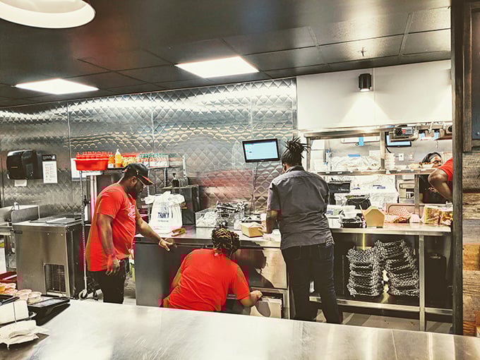 Behind the scenes where the magic happens—a choreographed dance of frying, spicing, and creating memories one piece of chicken at a time.
