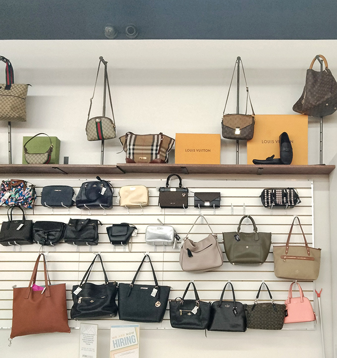 Designer handbags line the walls like trophies, from Louis Vuitton to Gucci—proof that luxury can be accessible with patience.