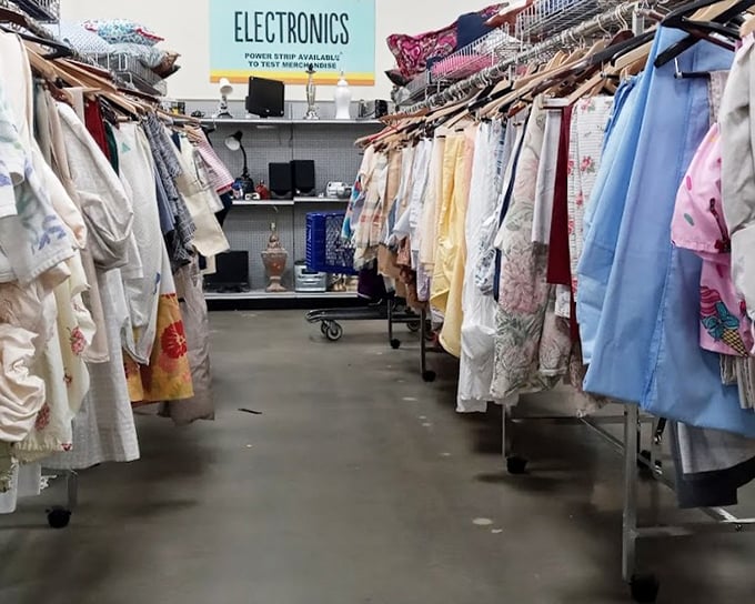 Between racks of vintage dresses, the electronics section peeks out—a tech time capsule where yesterday's gadgets find tomorrow's enthusiasts.