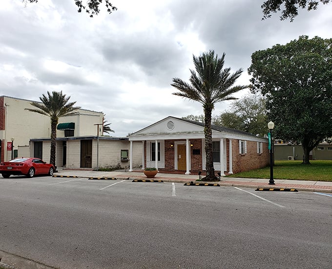 Community buildings with palm tree sentinels create the architectural rhythm of Auburndale—unpretentious, functional, and quintessentially Floridian.