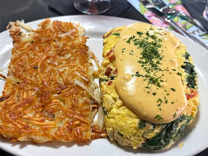 The omelet and hash browns duo – one fluffy, one crispy – a breakfast yin and yang that brings harmony to even the roughest morning after.