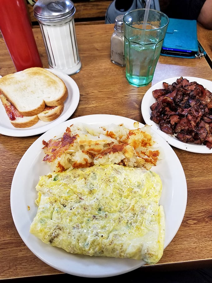 This omelet doesn't need fancy French technique—just perfectly cooked eggs wrapped around fillings with the confidence of a dish that knows its worth.