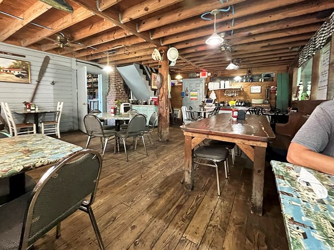 Exposed wooden beams overhead, well-worn floors below—this dining room has absorbed decades of laughter and seafood satisfaction.