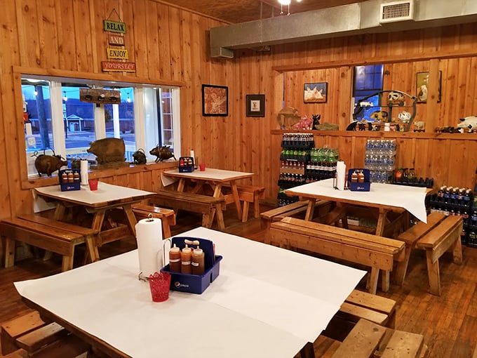 Picnic tables indoors mean one thing: roll up your sleeves and prepare for delicious mess. No pretension, just pure barbecue bliss.