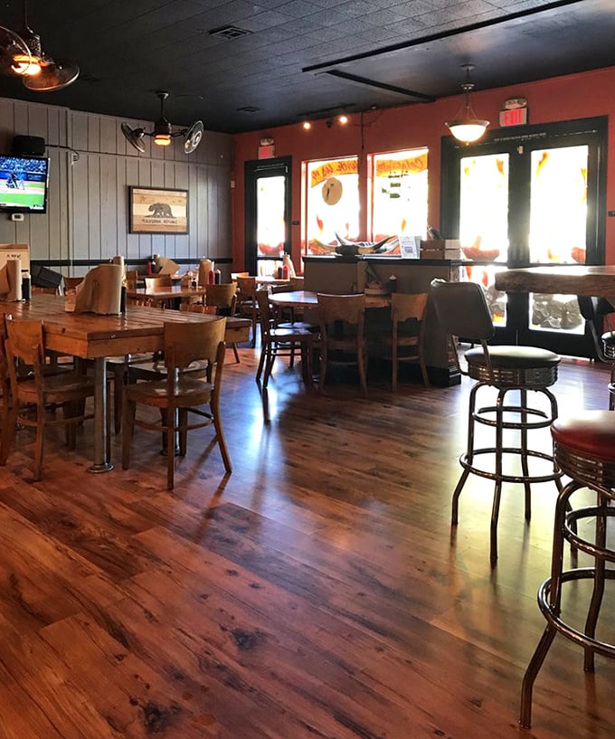 The dining room's warm wooden floors and casual seating say, "Stay awhile – your diet can wait until tomorrow."