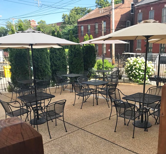 Outdoor dining that feels like a secret garden in the city, where umbrella-shaded tables invite you to savor sandwiches under St. Louis skies.