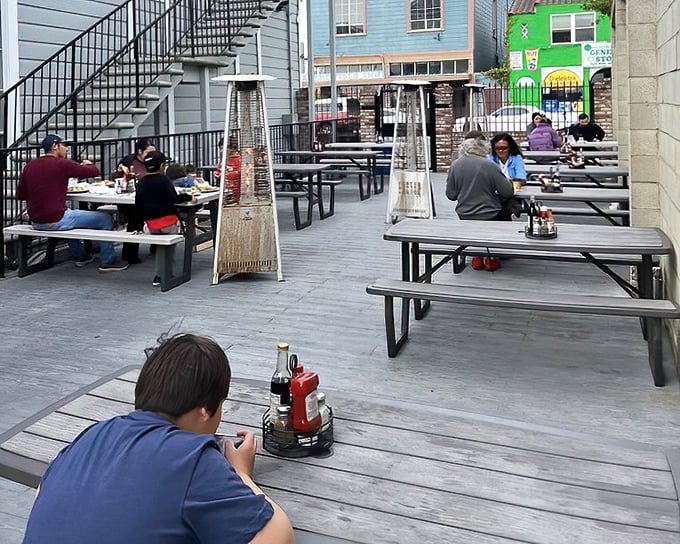 The outdoor seating area—where salty air enhances every bite. Those heat lamps ensure your seafood feast remains a warm experience year-round.