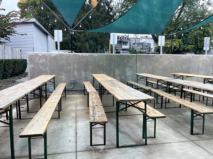 The outdoor seating area—where summer breezes complement beef brisket and conversations flow as freely as the local craft beer.