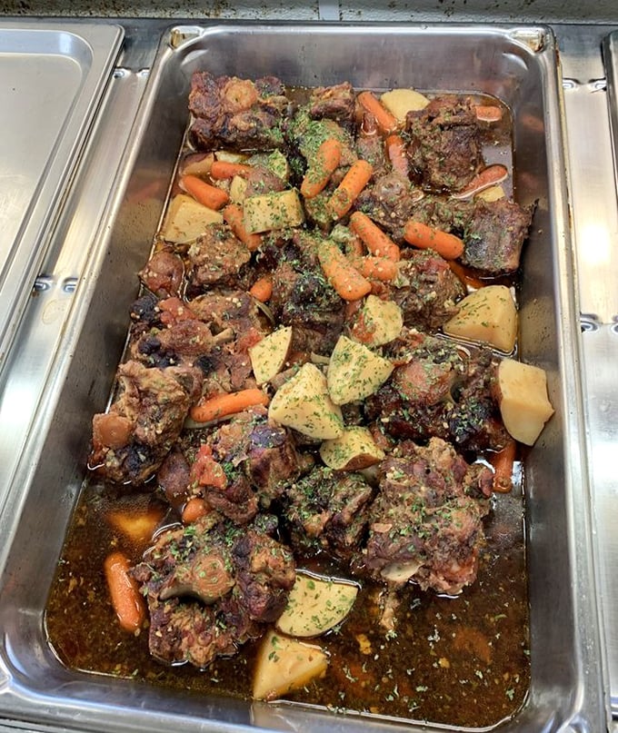 Oxtails swimming with potatoes and carrots in a rich gravy—proof that the most humble cuts often deliver the most magnificent flavors.