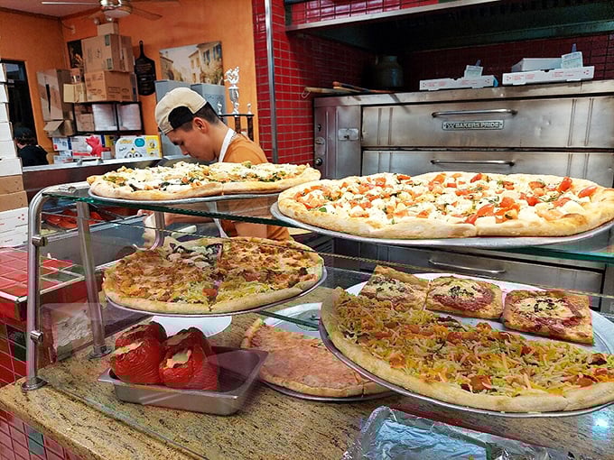 Pizza paradise on display—a showcase of possibilities that makes decision-making both wonderful torture and delicious anticipation. Choice has never looked so good.