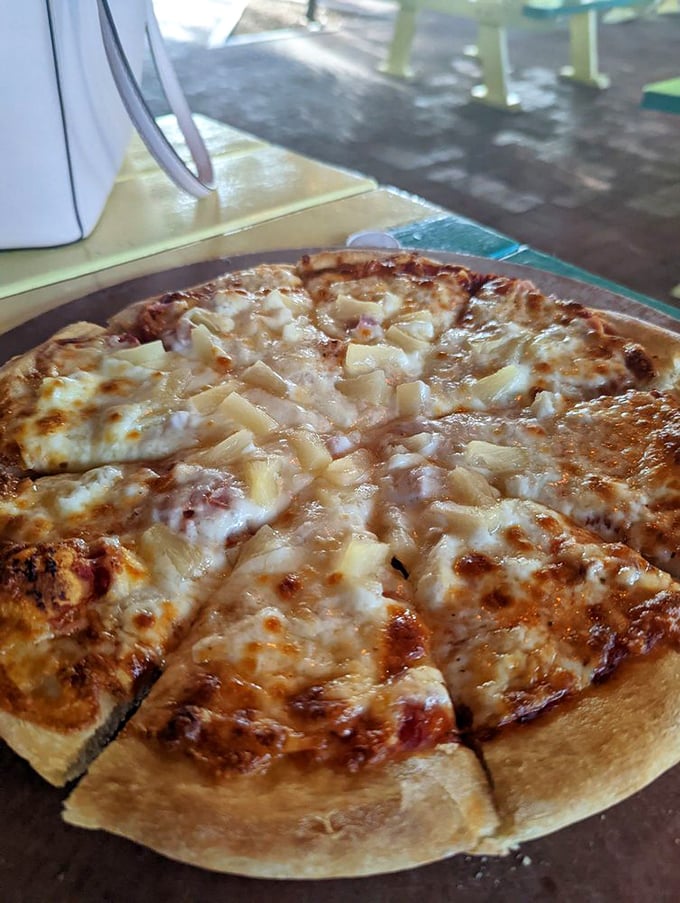 This Hawaiian pizza doesn't care about the pineapple controversy—it's too busy being absolutely delicious in its tropical confidence.