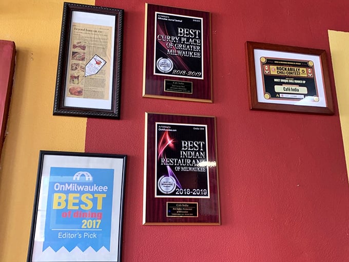The wall of awards tells the story that locals already know—this place isn't just good, it's officially Milwaukee's curry champion.