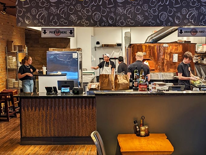 The ordering counter – where dreams are placed and pizza promises are made with a smile.