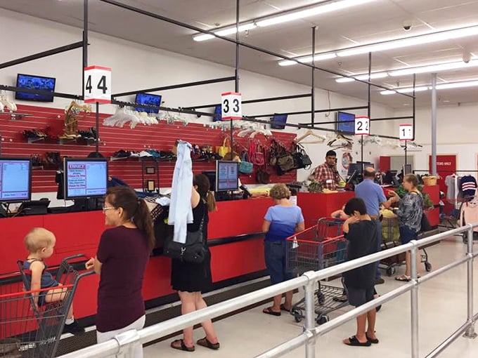 The checkout lanes stay busy as shoppers parade their finds like trophies from a successful hunt.