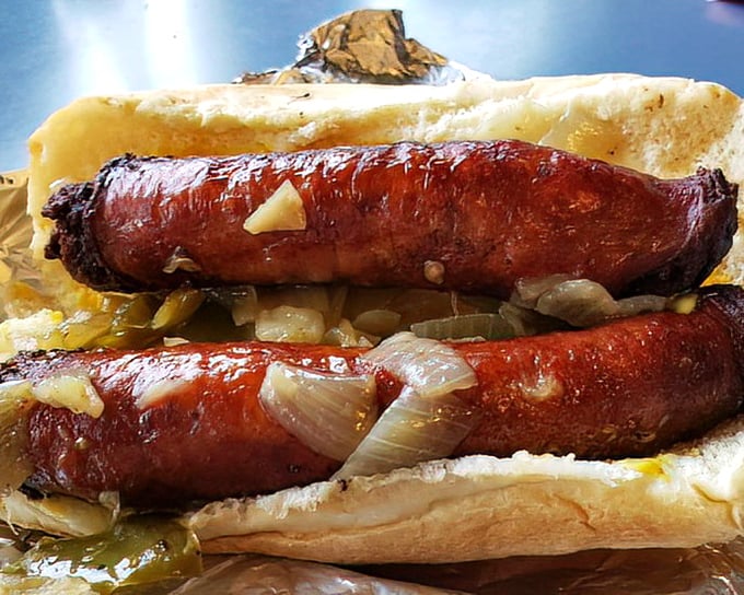 The sausage sandwich with peppers and onions – where smoke meets sweet in a handheld symphony that's worth setting your alarm for.