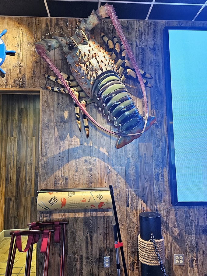 A colorful lobster art piece dominates the wall, reminding you exactly why you came—for spectacular seafood in unexpected places.
