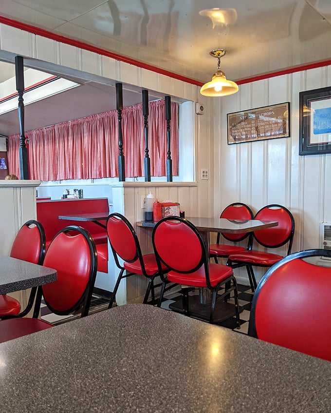 These red chairs aren't just seating—they're front-row tickets to the best breakfast show in Middletown, complete with checkered floor and nostalgic charm.