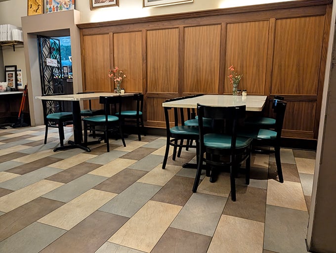 Simple tables await their next guests. No pretension here—just honest furniture that's supported countless elbows and witnessed innumerable "mmms" of satisfaction.