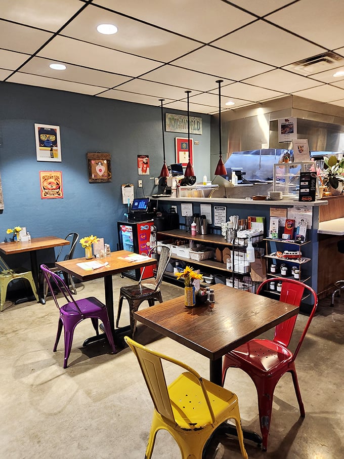 Mismatched chairs in primary colors invite you to sit, stay, and contemplate the important things in life—like what to order next.
