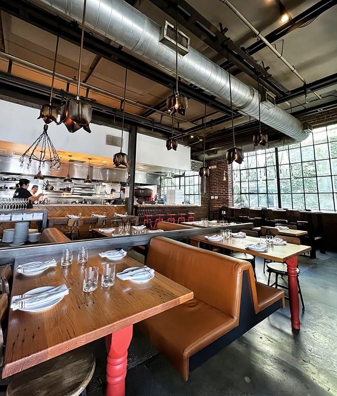 High ceilings and exposed infrastructure create a space that breathes with possibility—like dining in a cathedral dedicated to culinary creativity.