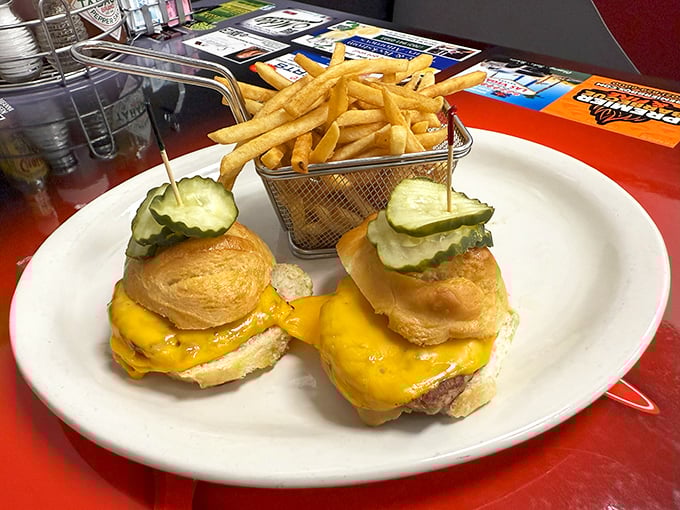 These sliders aren't "mini" anything—they're perfectly proportioned flavor bombs with melty cheese and crisp pickles. The fry basket isn't just cute, it's strategic.