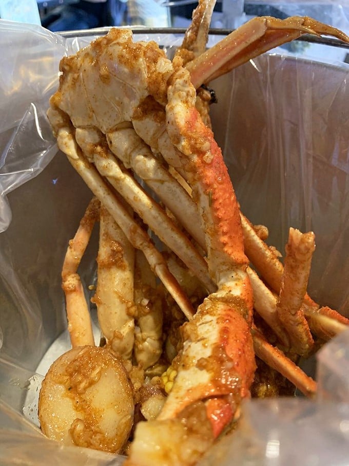 Snow crab legs bathed in seasoned glory—nature's perfect design for making you work just enough to appreciate each sweet morsel.