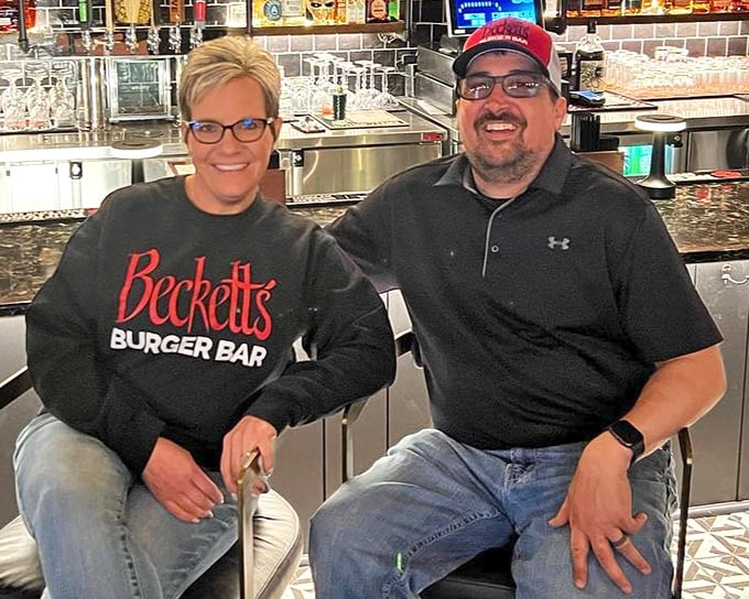 These two clearly know where the magic happens – right there behind that well-stocked bar of dreams.