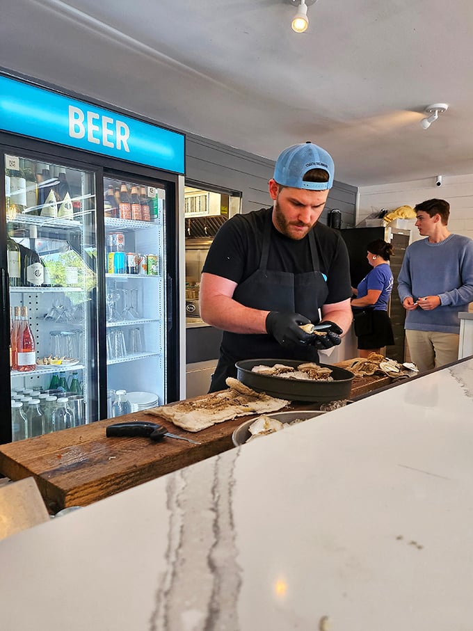 Watch as skilled hands transform humble oysters into treasures – the raw bar equivalent of a front-row theater seat.