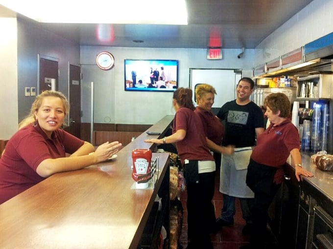 The counter experience—where solo diners become temporary family and servers remember your order before you've fully settled onto your stool.