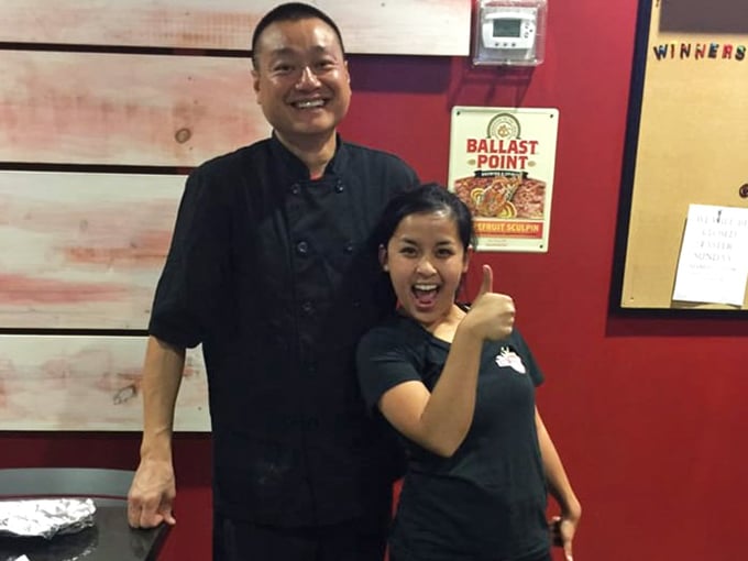 The smiles say it all—when you're making food this good, happiness is contagious. Passion is the secret ingredient.