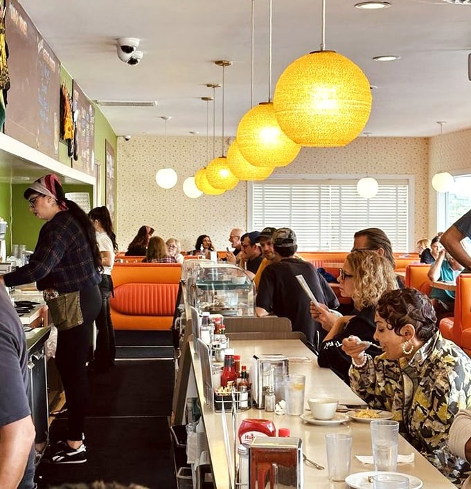 The bustling counter scene showcases why Cindy's has endured—real food served by real people in a space that feels instantly familiar.