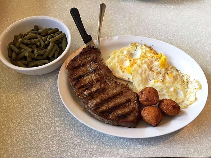 Breakfast of champions: a perfectly grilled steak alongside sunny-side-up eggs that look like they're winking at your good life choices.