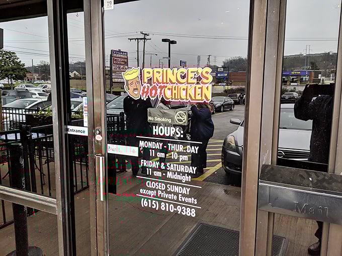 The hours posted clearly on the door—crucial information for planning your hot chicken pilgrimage. Note the weekend midnight closing—Nashville knows when spice cravings hit hardest.