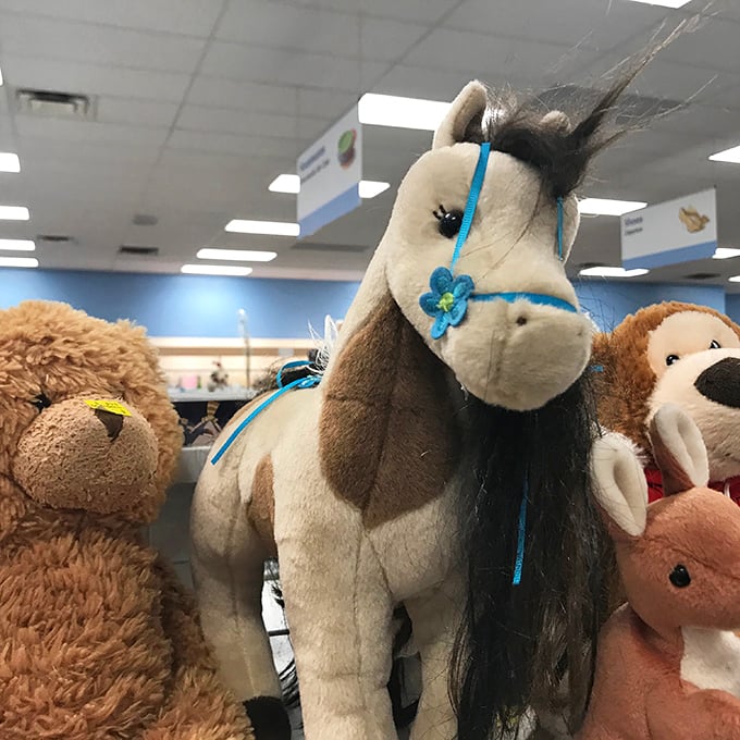 Plush paradise! This stuffed horse with its blue flower isn't just a toy—it's a future best friend waiting for the right child.
