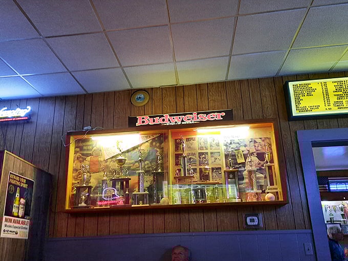 Trophy case or shrine to local pride? Either way, this illuminated display case tells stories of community victories between sips of cold beer.