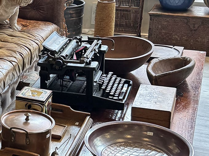 Analog dreams come alive with this vintage typewriter display—surrounded by brass bowls and wooden boxes from simpler times.