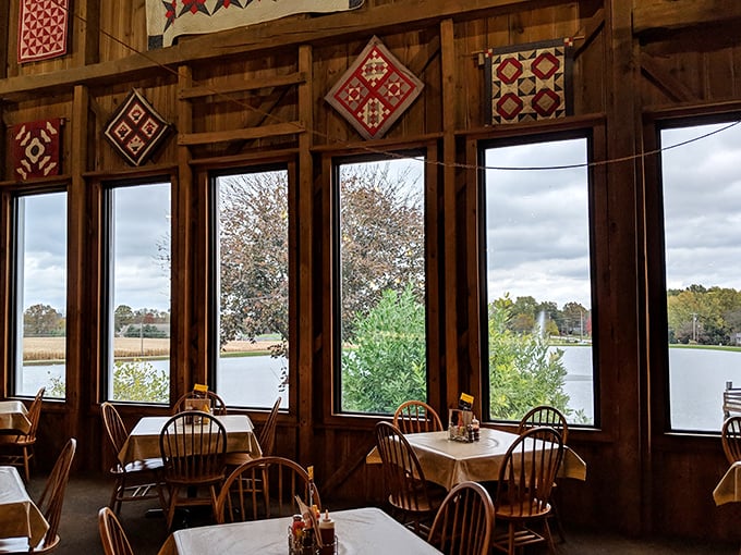 Sunlight streams through windows framed by handmade quilts, offering diners a view that pairs perfectly with comfort food classics.