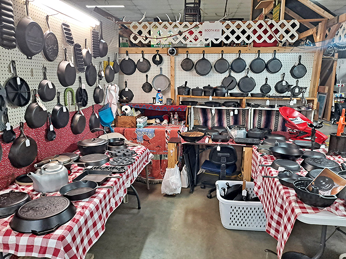Cast iron paradise! This cookware collection would make your grandmother swoon – decades of seasoning potential hanging from every available inch.
