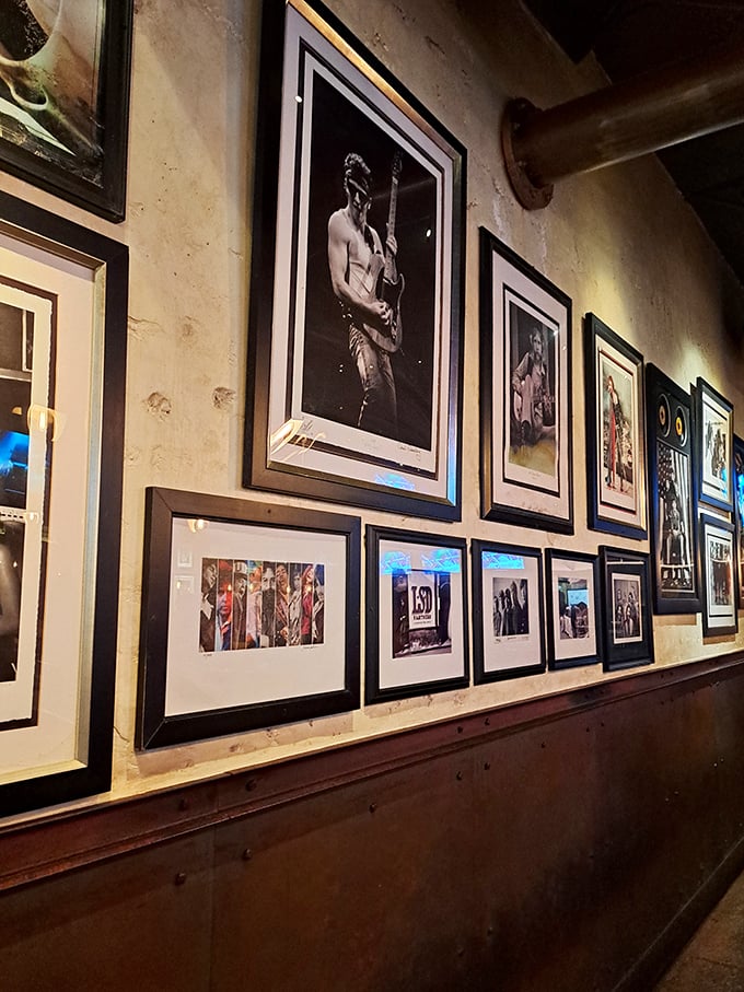 Wall art that tells you this place takes its music as seriously as its menu—a visual playlist spanning decades of rock history.