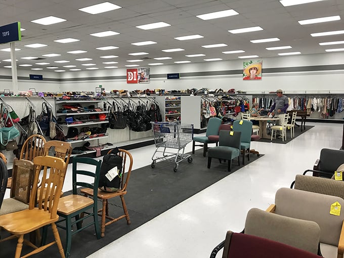 The furniture section stretches far and wide—a secondhand showroom where vintage wooden chairs mingle with contemporary office castoffs.