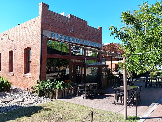 Historic brick walls house Phoenix's most celebrated pizza artistry and culinary innovation.