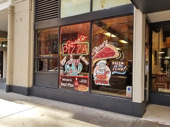 Classic neon signs and downtown energy - Rosa's keeps New York pizza tradition alive. 