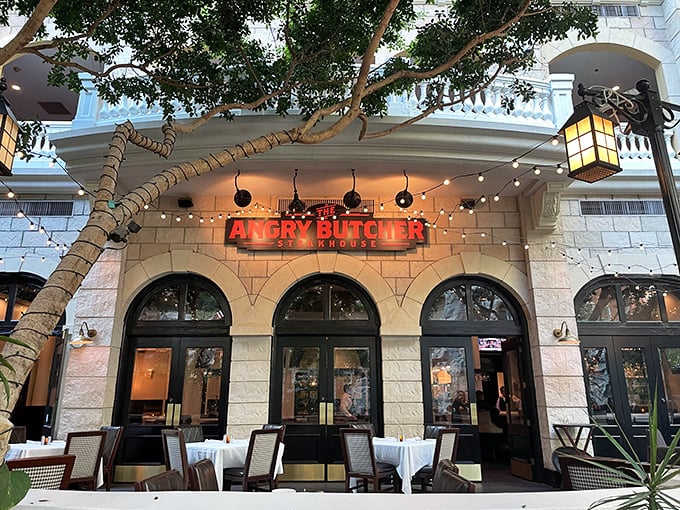 String lights and bold signage create an inviting atmosphere where serious steaks meet casual good times.