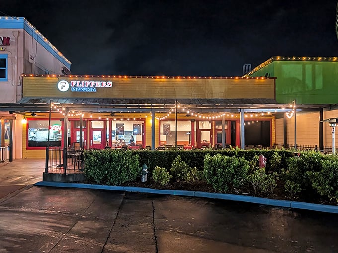 Colorful lights promise fun times and full bellies – tourist trap done right.