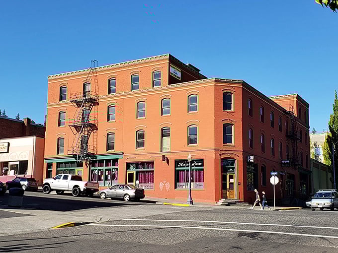 The historic brick buildings of downtown Hood River stand proudly against blue skies, inviting exploration of local shops.
