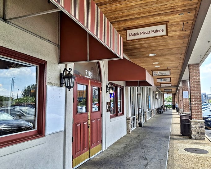 The unassuming strip mall home of Malek's is like pizza's version of Clark Kent – ordinary outside, super powers inside.