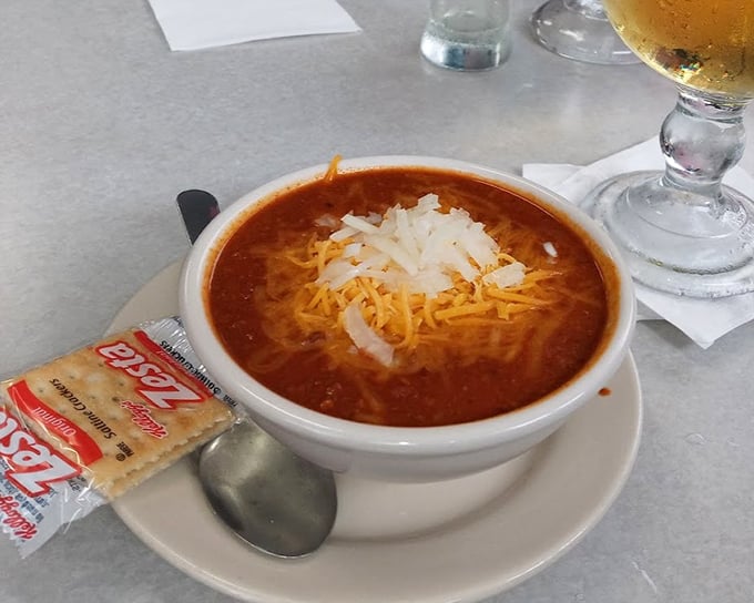 The 5-Alarm Chili topped with melted cheese arrives with crackers and a cold beer chaser—the perfect remedy for Indiana winter blues.