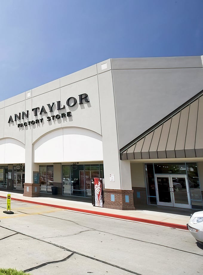 Ann Taylor Factory Store: where workwear meets wallet-friendly prices. That red curb isn't just for show—it's marking the boundary between full retail and sweet, sweet savings.