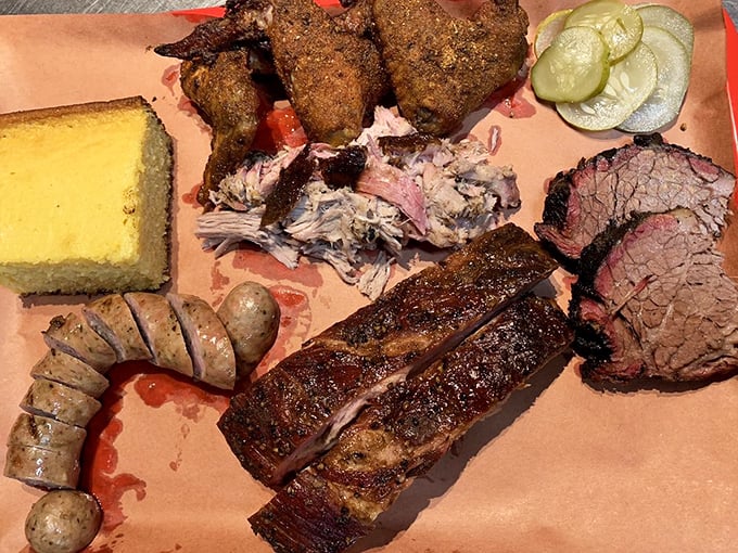 The BBQ sampler platter—where FOMO goes to die and food comas are born. Worth every minute of the inevitable nap that follows.