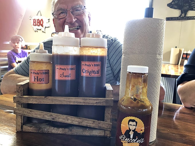 The sauce caddy – Hot, Sweet, and Original – the three wise condiments that elevate already excellent meat to legendary status.